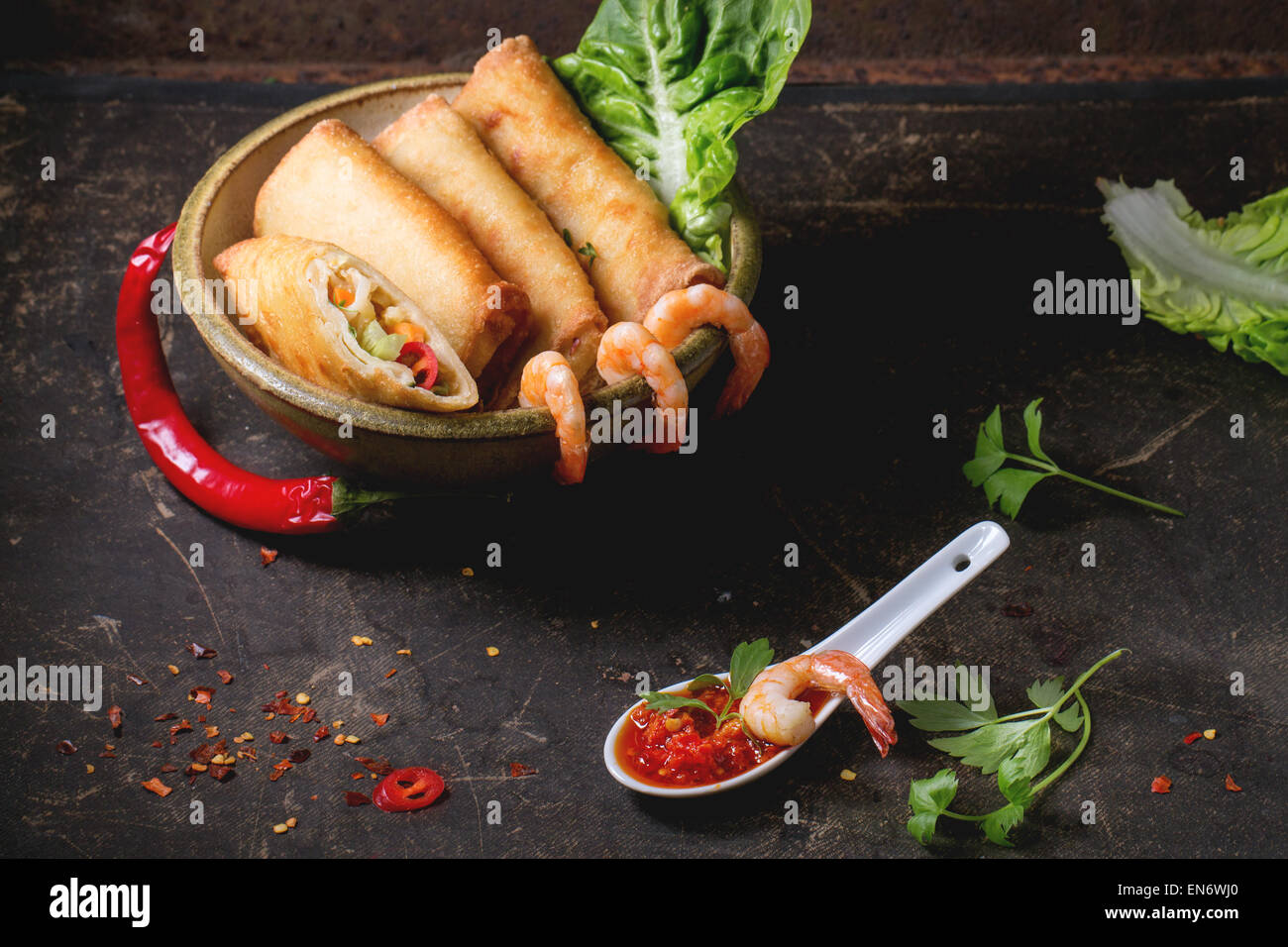 Fried spring rolls with vegetables and shrimps, served in ceramic bowl ...