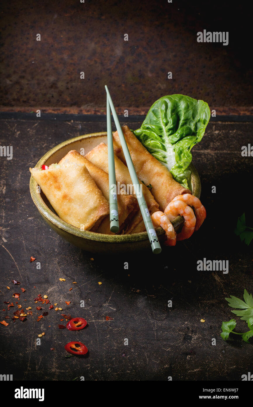 Fried spring rolls with vegetables and shrimps, served in ceramic bowl ...