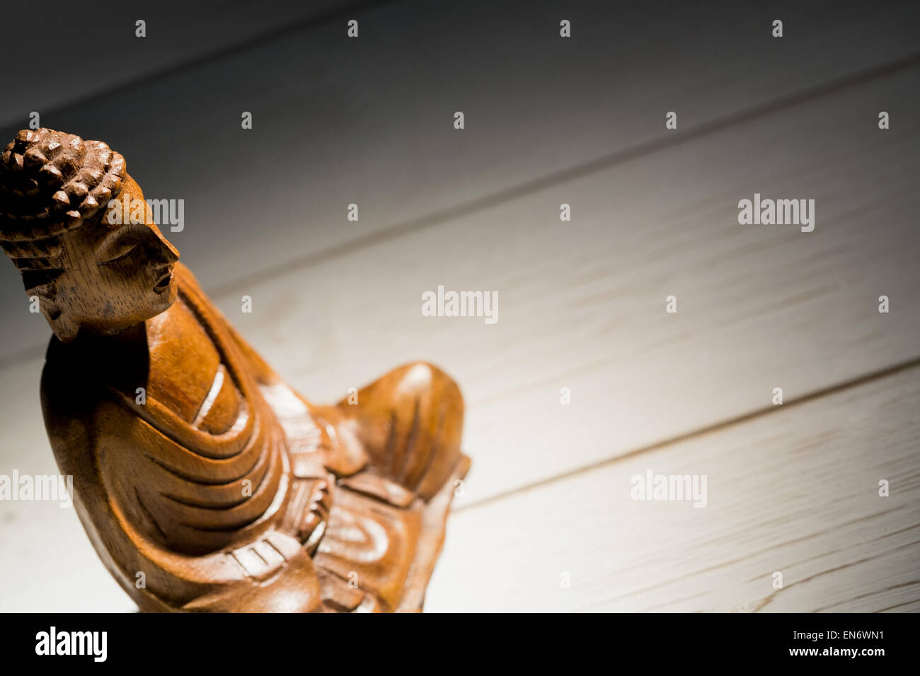 Buddha statue on a table Stock Photo - Alamy