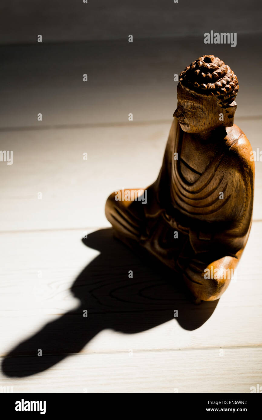 Buddha statue on a table Stock Photo - Alamy