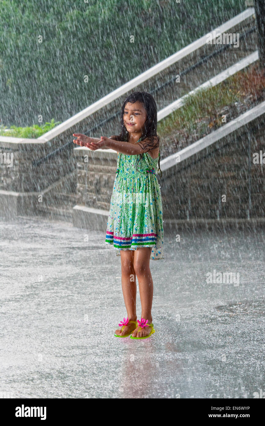 Girl standing in rain hi-res stock photography and images - Alamy