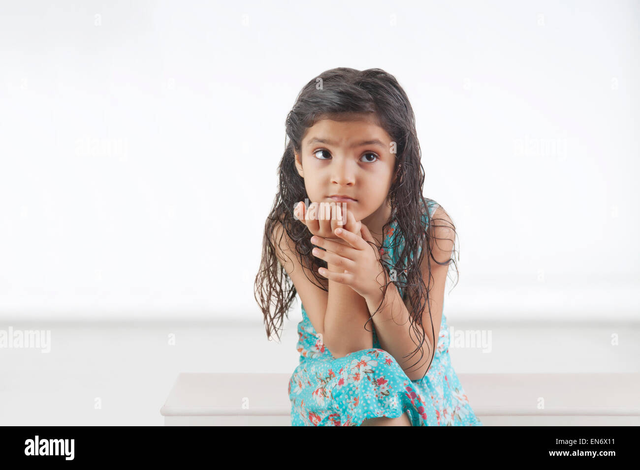 Little girl thinking Stock Photo - Alamy
