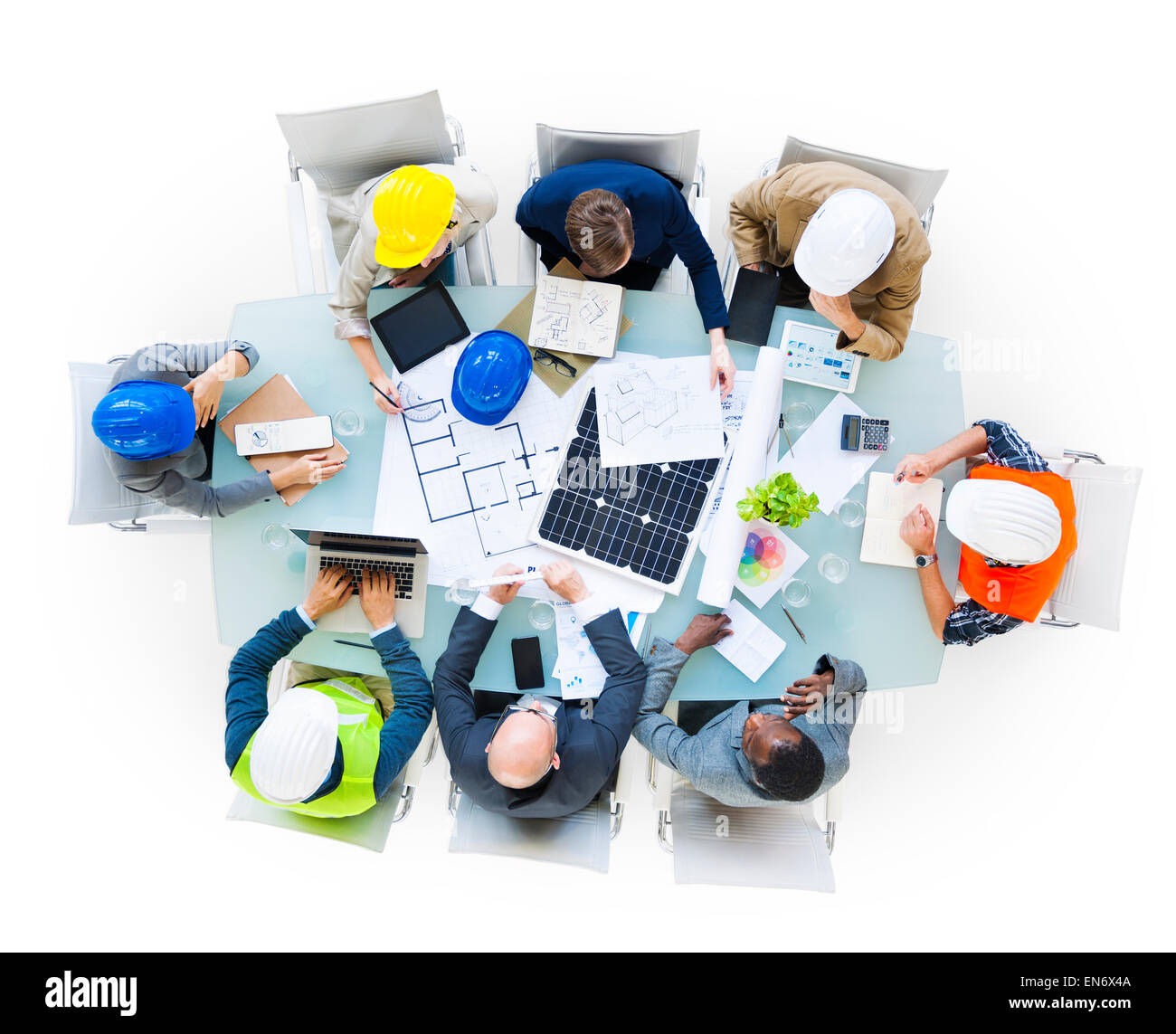 Group Of Construction Site Workers On A Conference Table Holding A ...