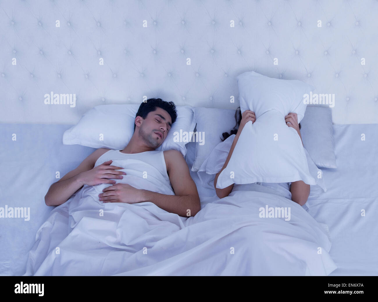 Woman covering face bed hi-res stock photography and images - Alamy