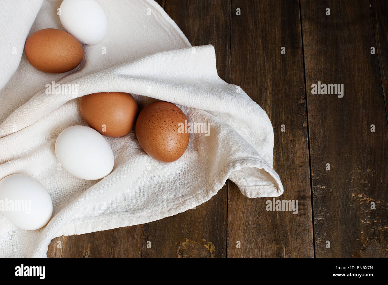 Chicken eggs on the old table Stock Photo - Alamy