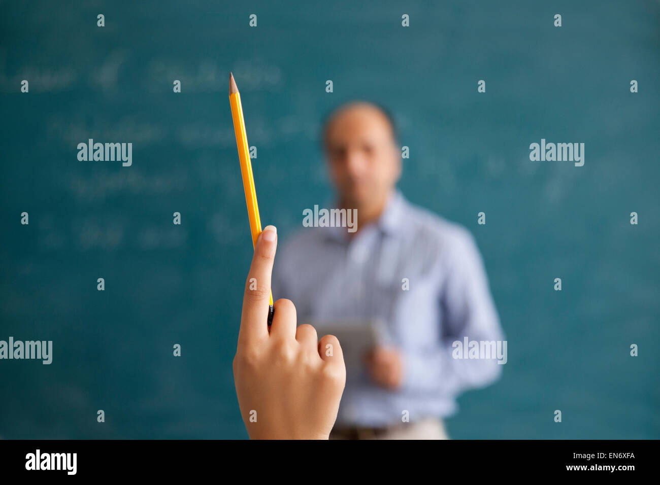 Hand holding pencil hi-res stock photography and images - Alamy