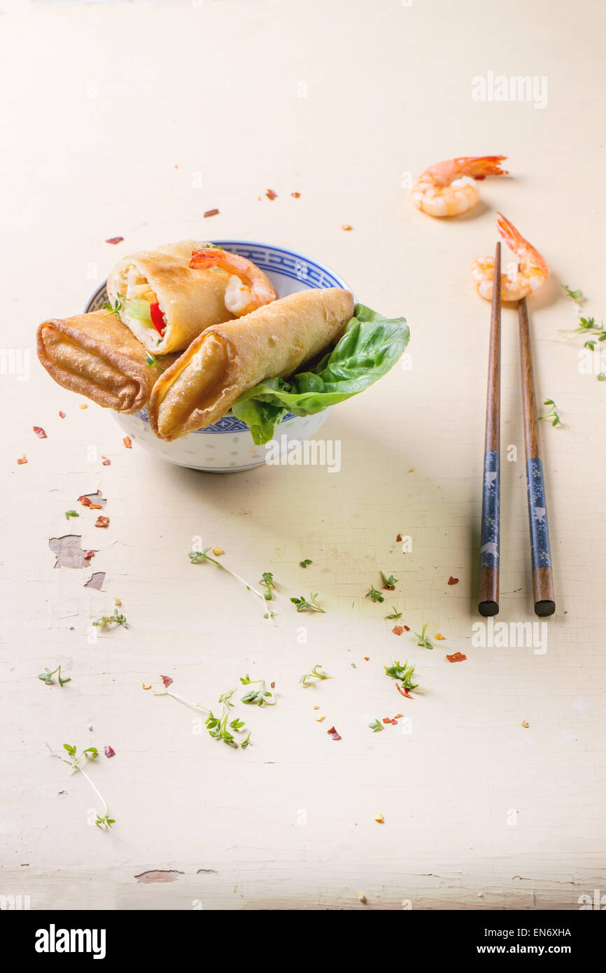 Fried spring rolls with vegetables and shrimps, served with spicy sauce ...