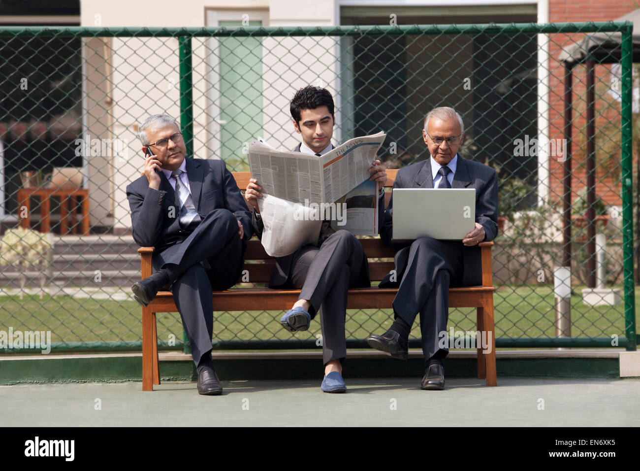 Indian men reading newspaper hi-res stock photography and images - Alamy