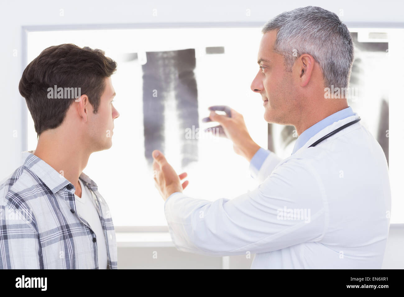 Doctor explaining X rays to his patient Stock Photo - Alamy