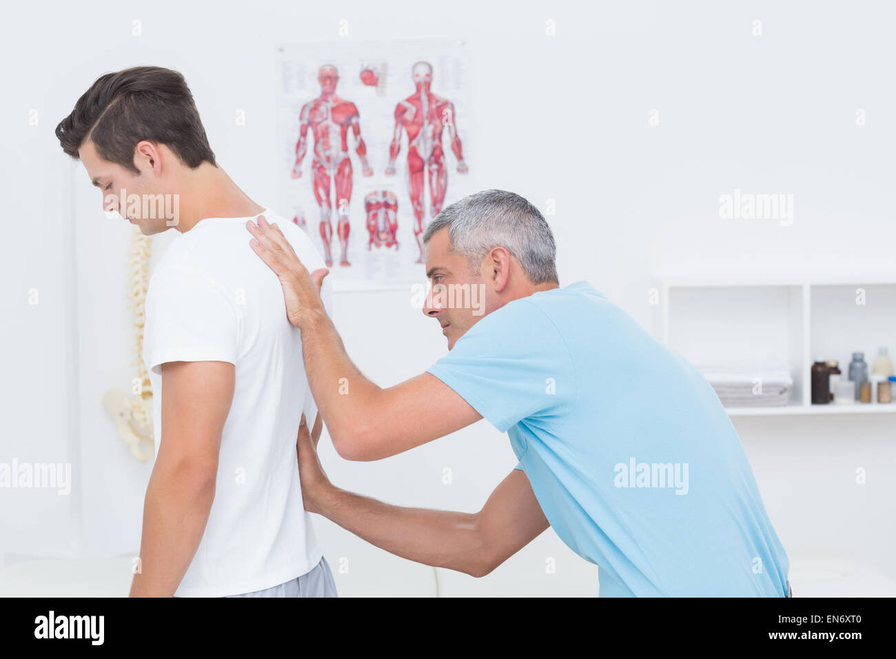 Doctor examining his patient back Stock Photo - Alamy