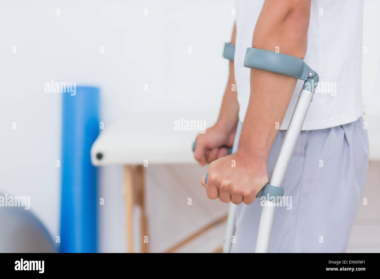 Patient standing with crutch Stock Photo - Alamy