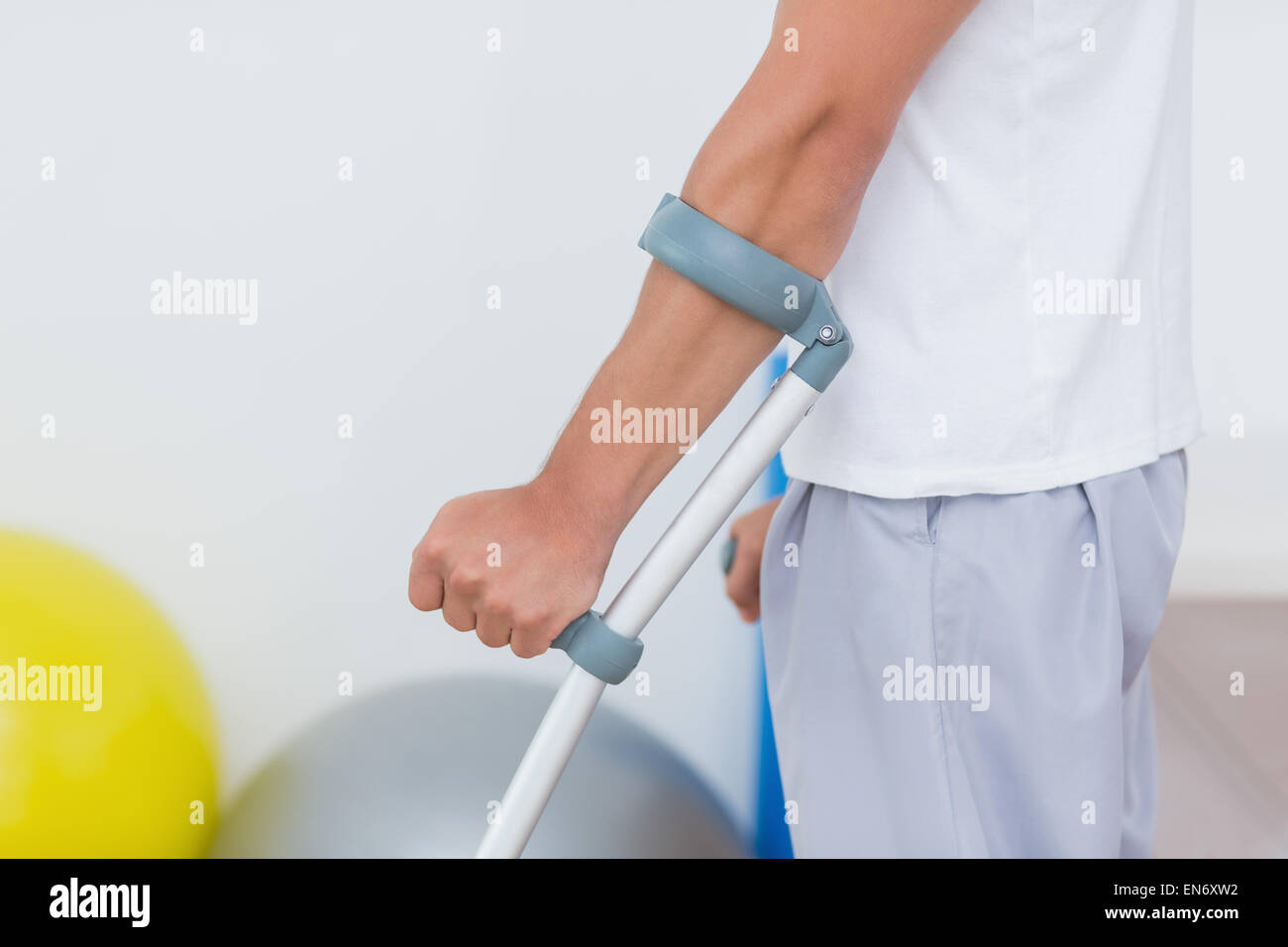 Patient standing with crutch Stock Photo - Alamy