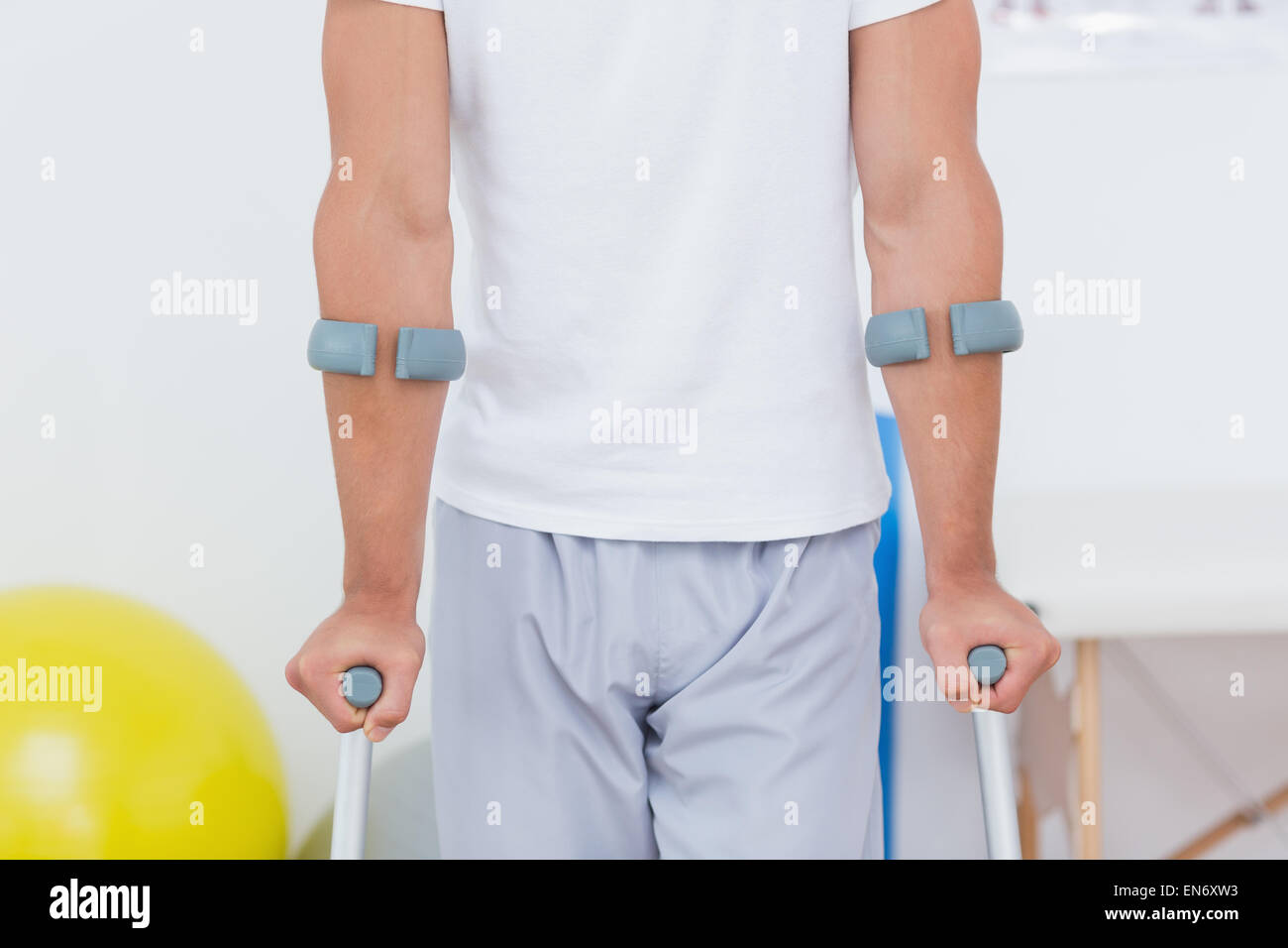 Patient standing with crutch Stock Photo - Alamy
