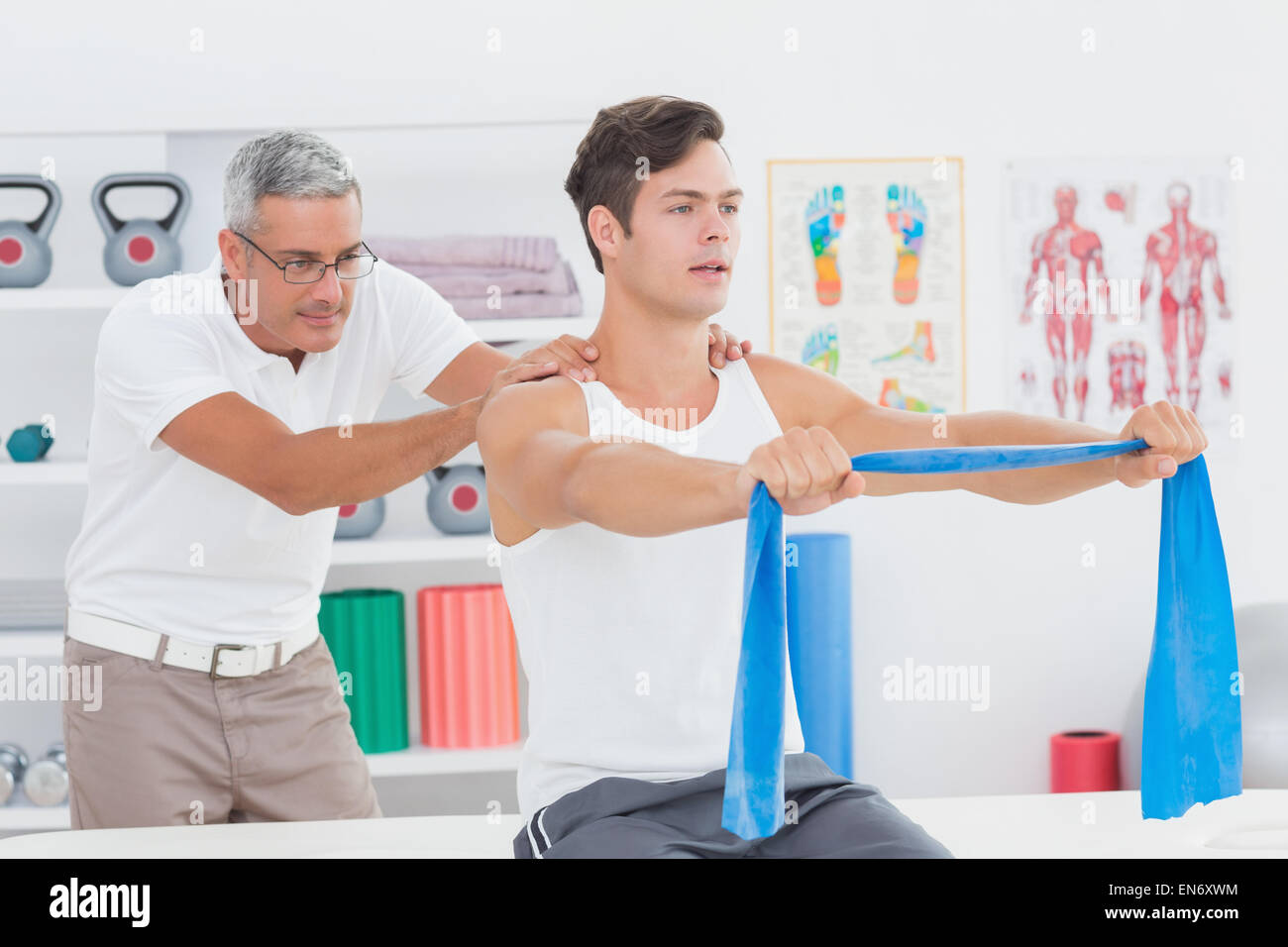 Doctor examining his patient back Stock Photo - Alamy