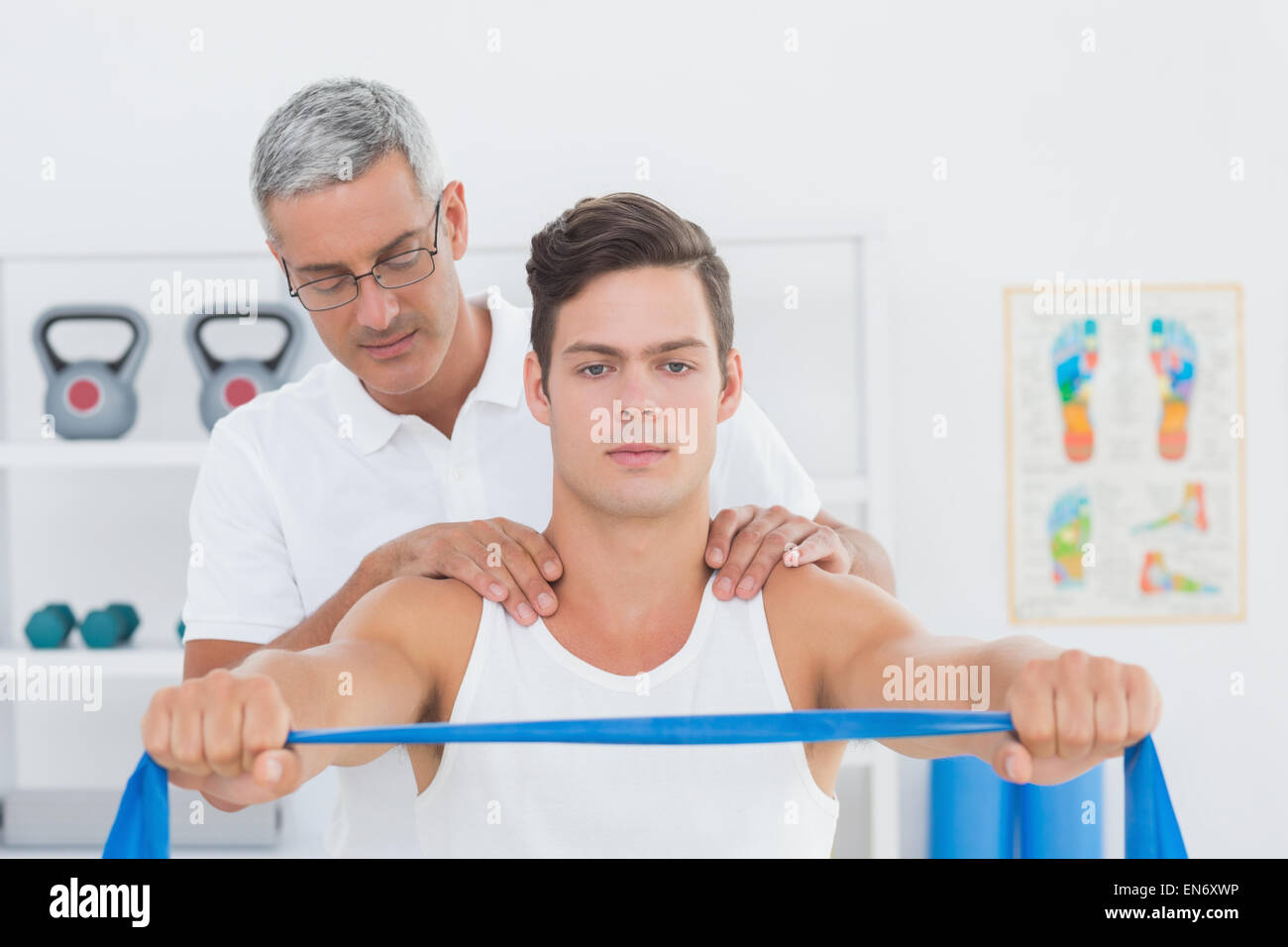 Doctor examining his patient back Stock Photo - Alamy