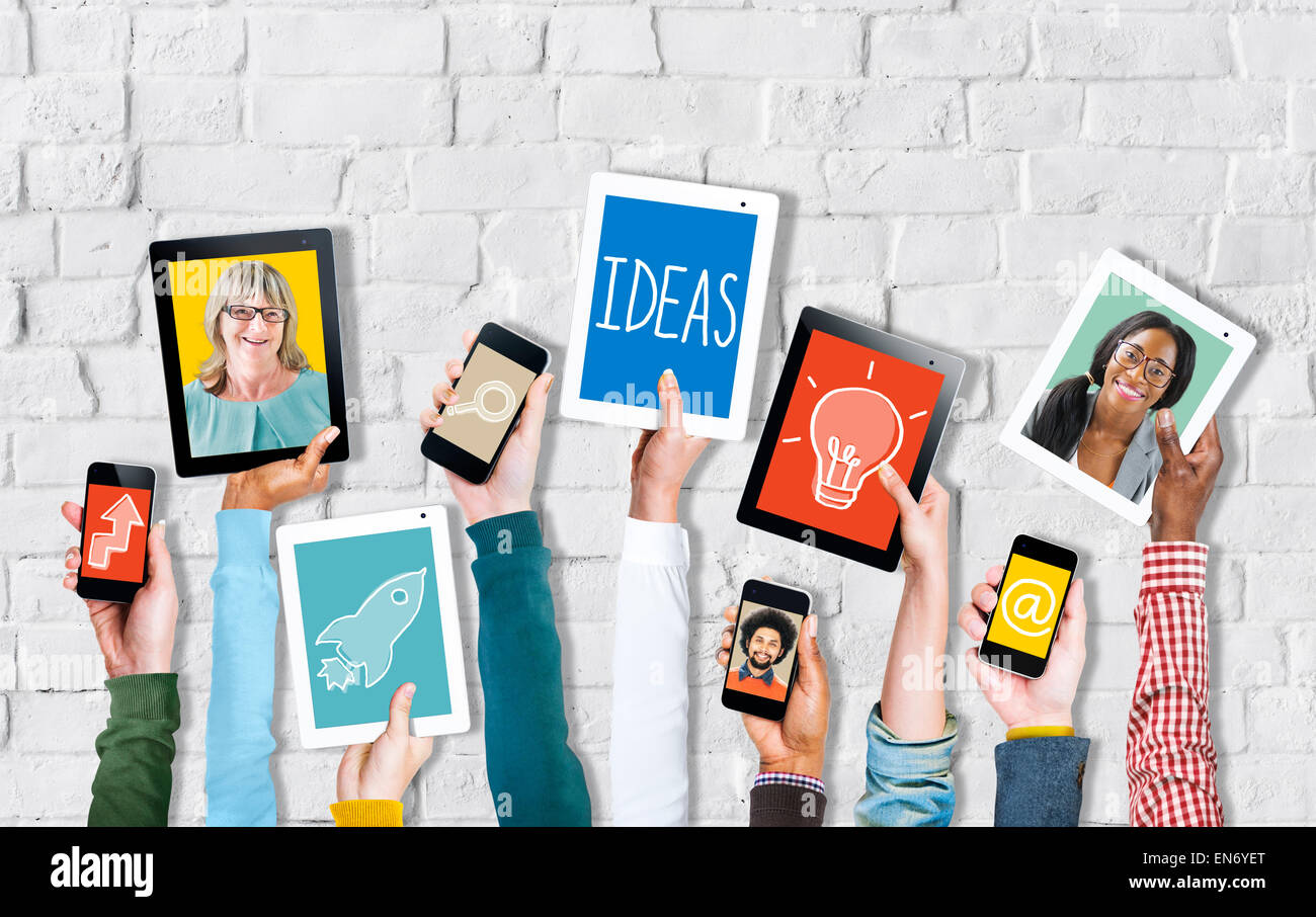 Group of Hands Holding Digital Devices with Ideas Concept Stock Photo ...