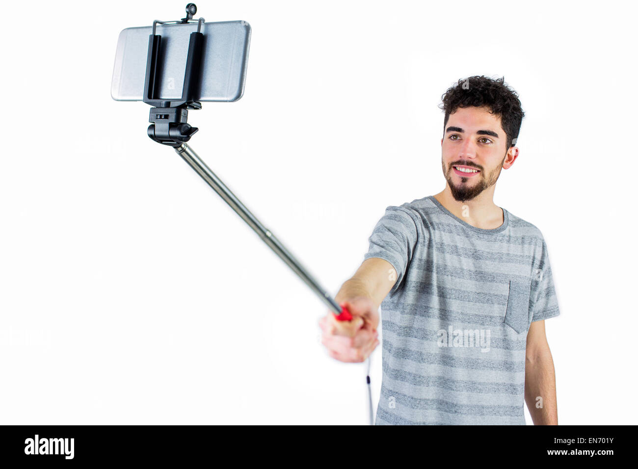 Holding a selfie stick Cut Out Stock Images & Pictures - Alamy