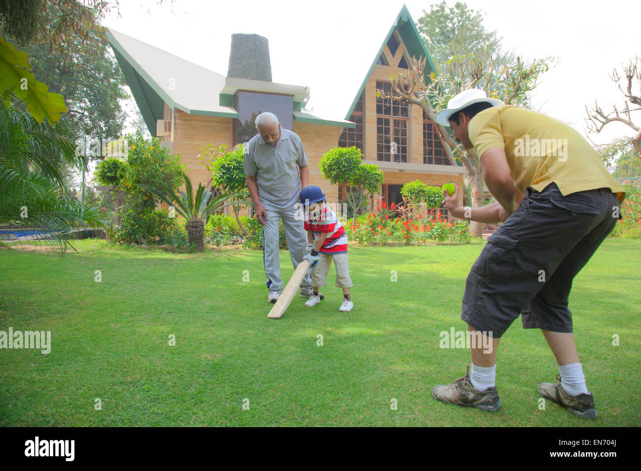 Boy playing cricket father hi-res stock photography and images - Alamy