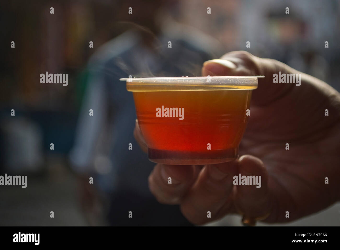 Man holding cup of a tea Stock Photo - Alamy