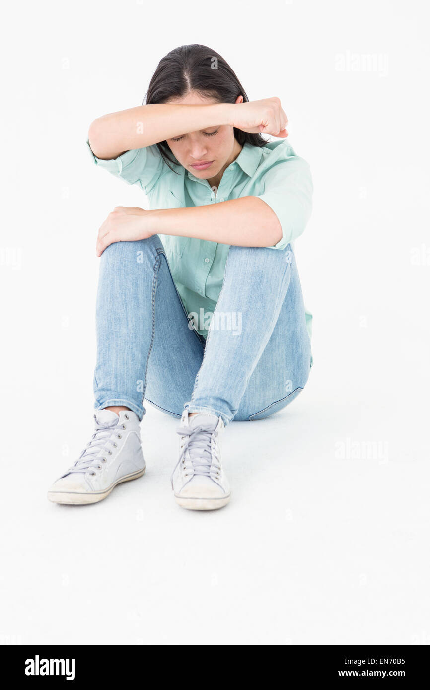 Sad woman sitting on the floor and hiding her face Stock Photo - Alamy