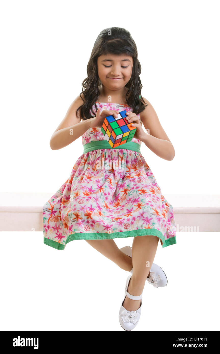 Girl with Rubiks cube Stock Photo - Alamy