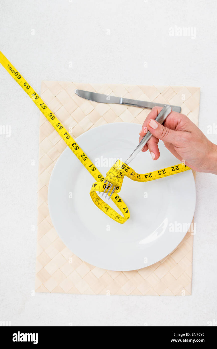 Measuring tape around the fork Stock Photo - Alamy