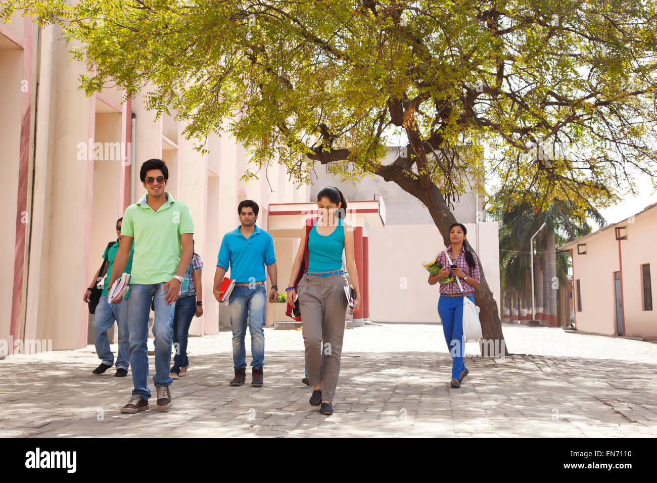 Portrait of a male college student looking back Stock Photo - Alamy