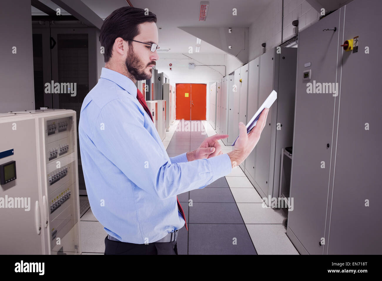 Composite image of businessman scrolling on his digital tablet Stock ...