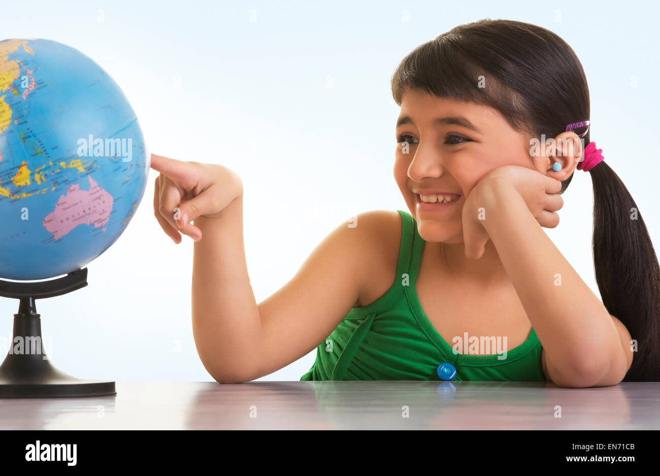 Person looking at world globe hi-res stock photography and images - Alamy