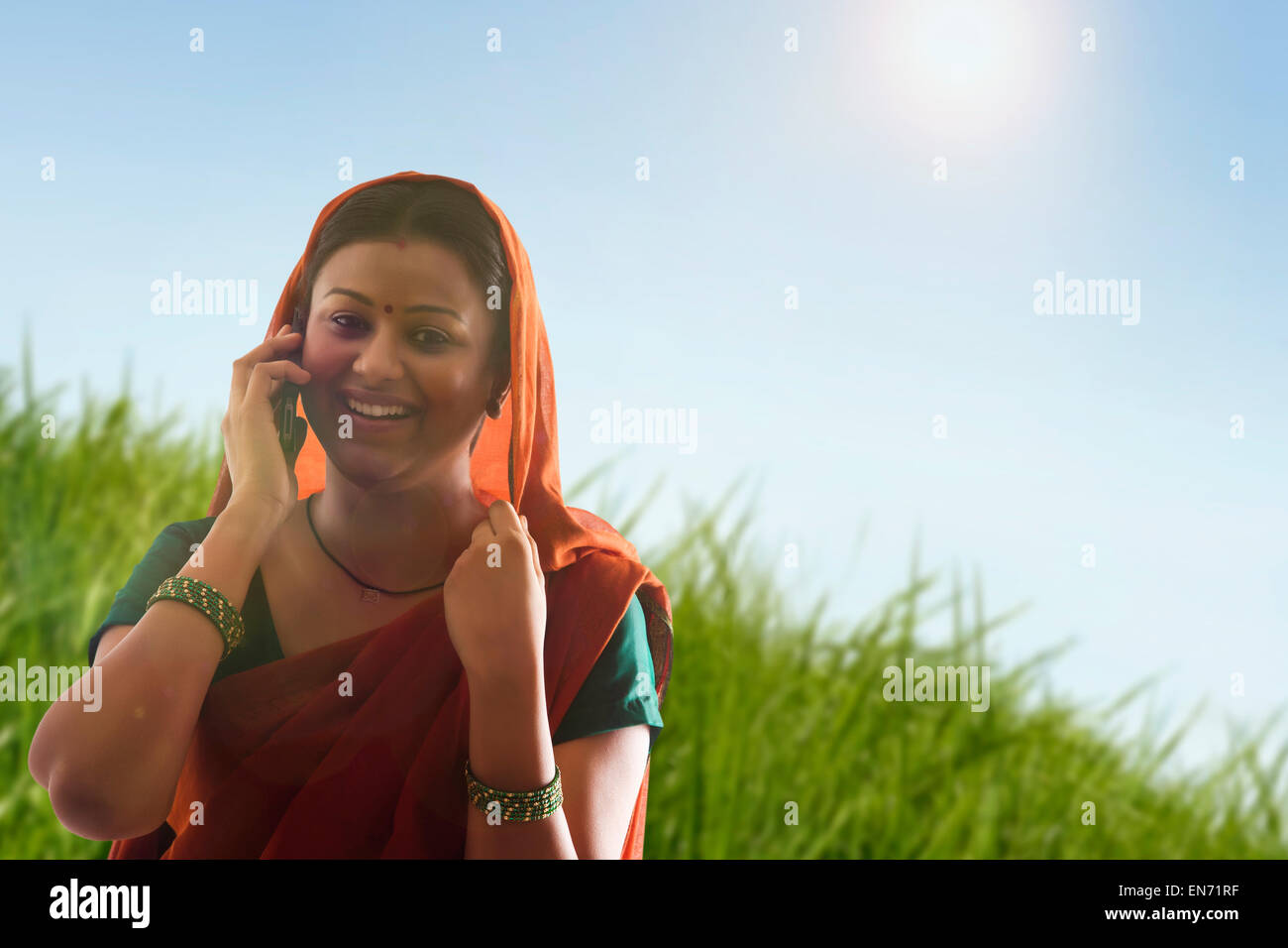 Rural woman talking on mobile phone Stock Photo - Alamy
