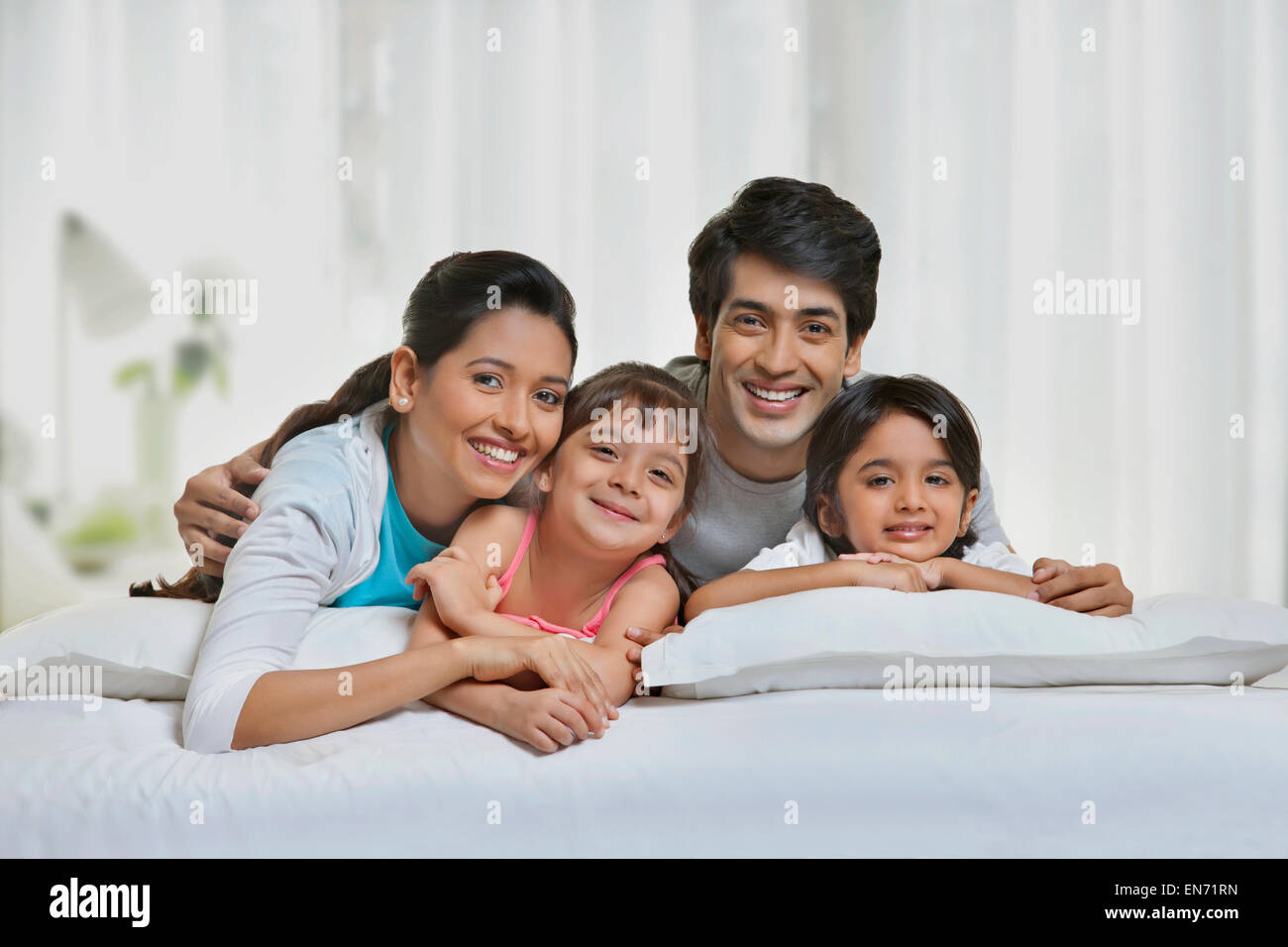 Portrait of family smiling Stock Photo - Alamy