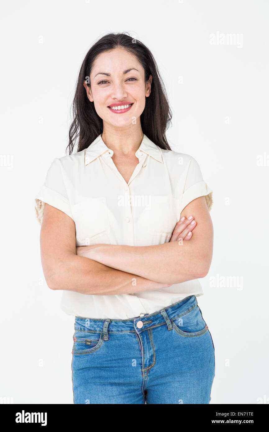 Smiling woman standing arms crossed Stock Photo - Alamy