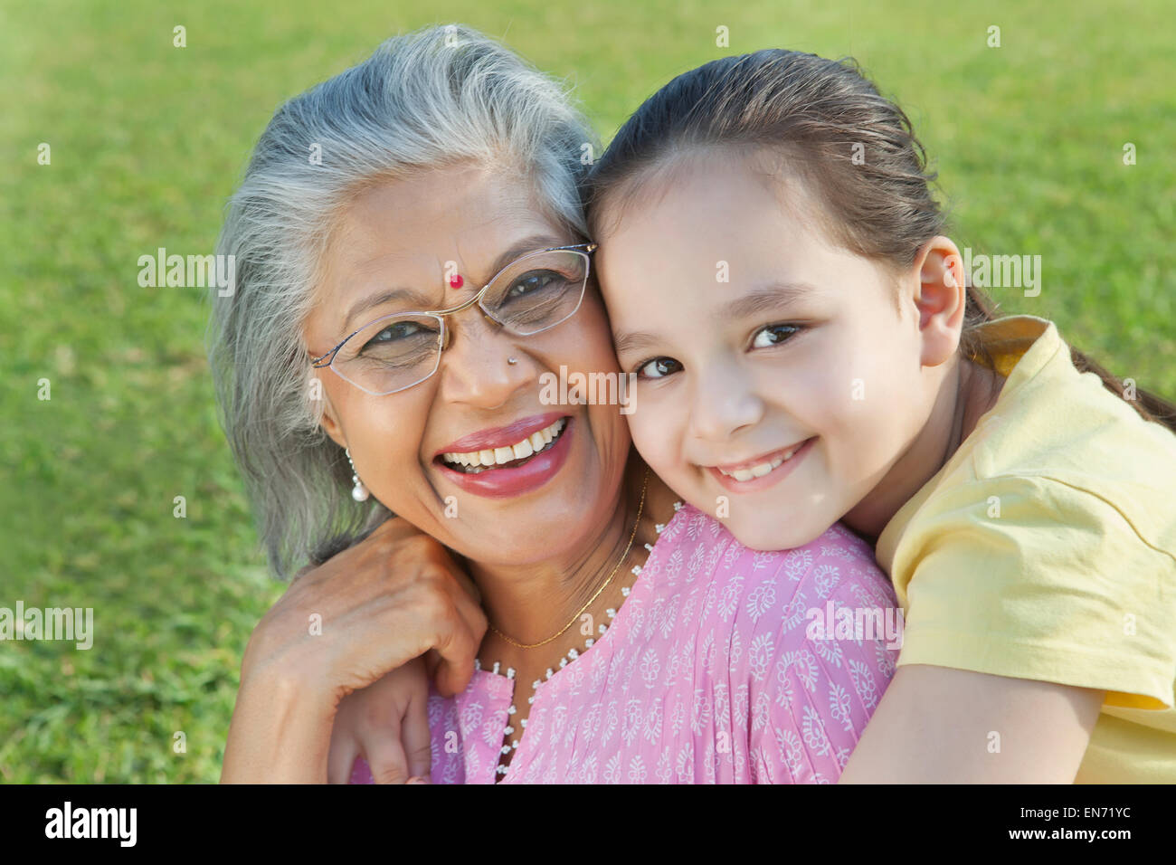 Portrait of grandmother and granddaughter smiling Stock Photo - Alamy