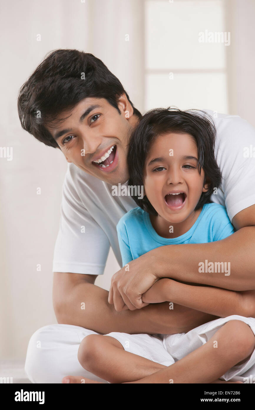 Portrait of father and son Stock Photo - Alamy