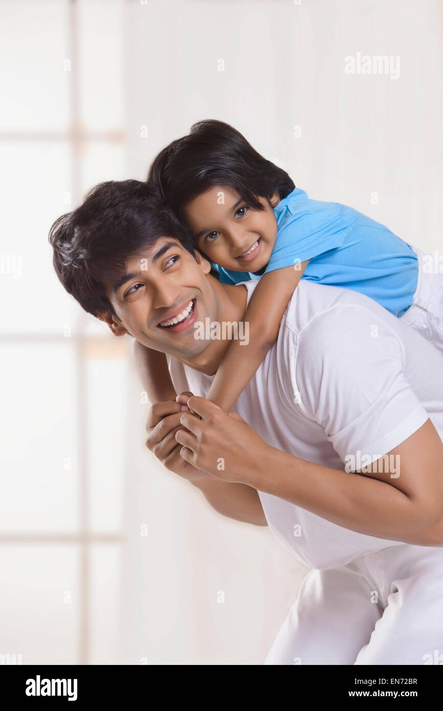 Portrait of father and son smiling Stock Photo - Alamy