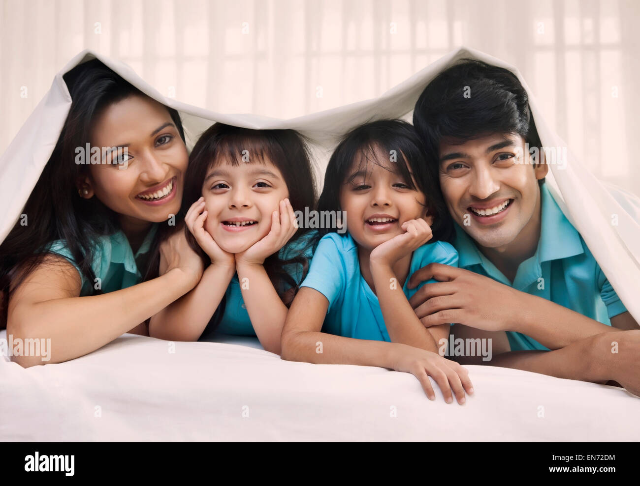 Portrait of family smiling Stock Photo - Alamy