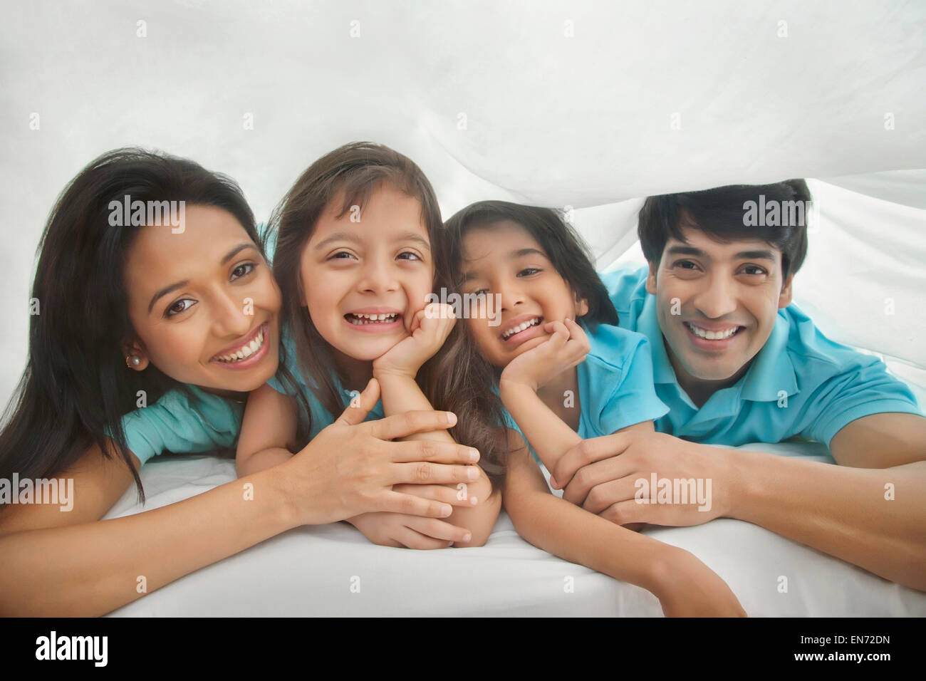 Portrait of family smiling Stock Photo - Alamy