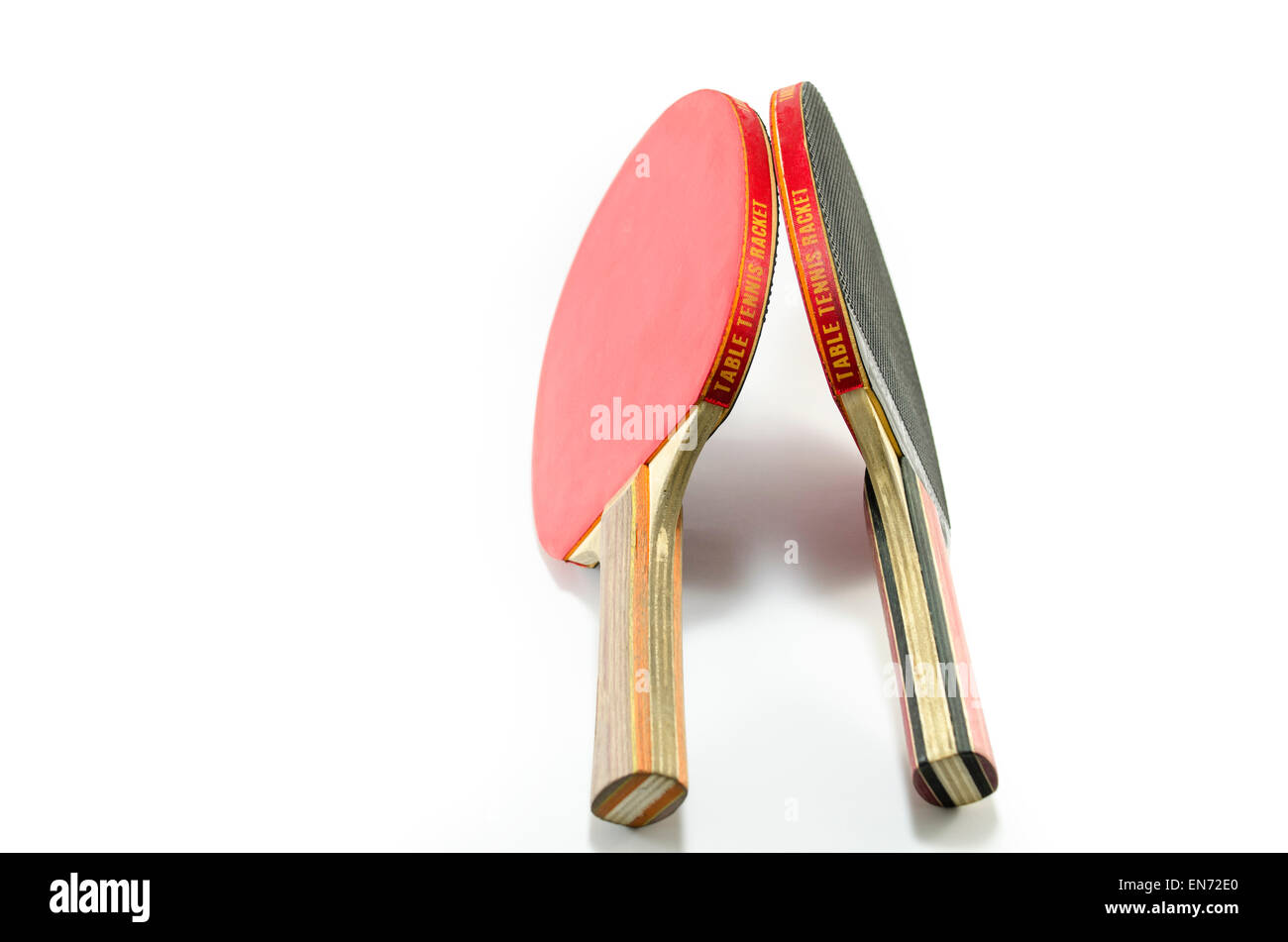 Two ping-pong rackets and a ball isolated on white Stock Photo - Alamy