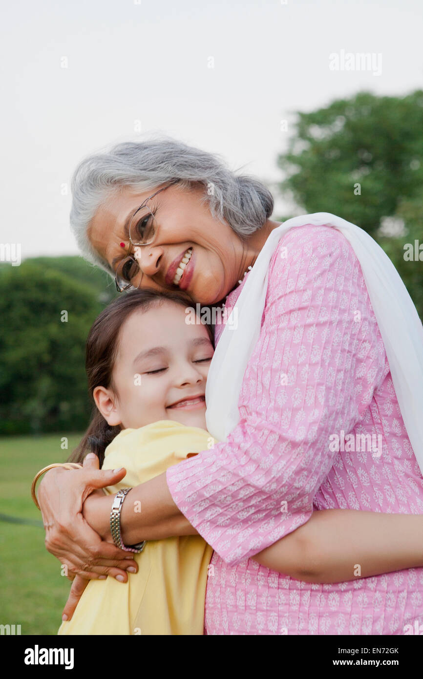 Grandmother and granddaughter hugging Stock Photo - Alamy