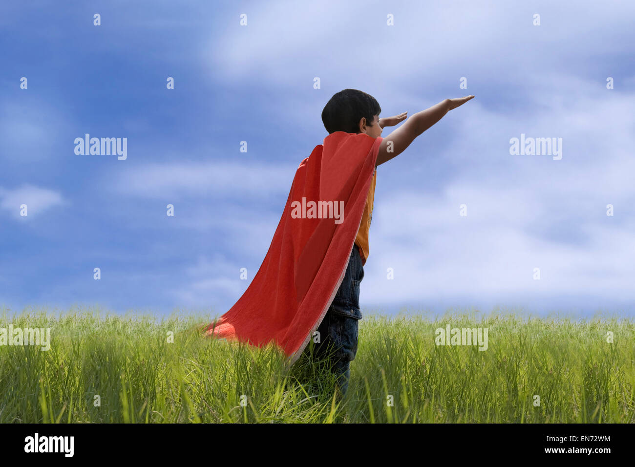 Child posing as Superman Stock Photo - Alamy