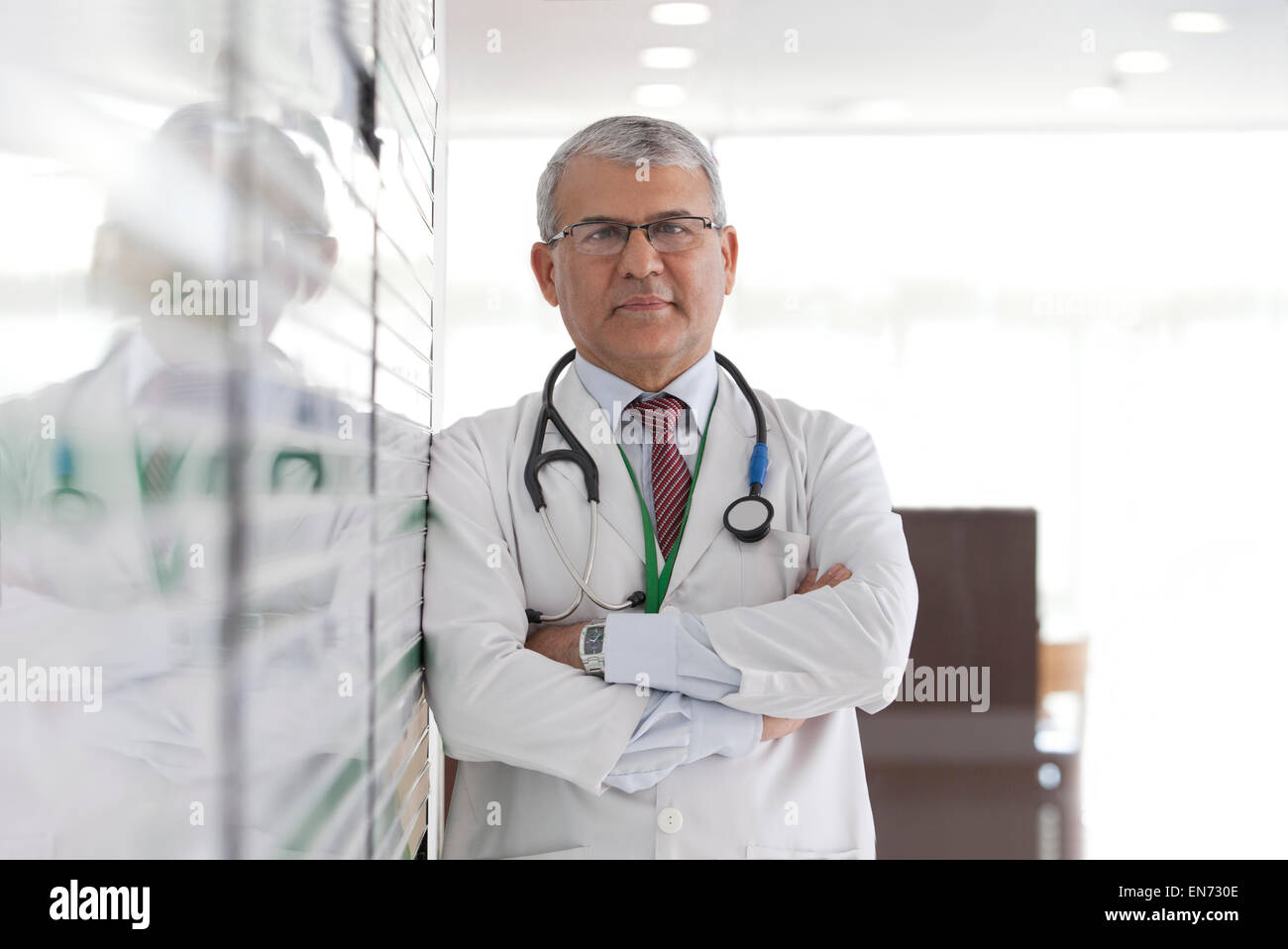 Portrait of a senior doctor Stock Photo - Alamy