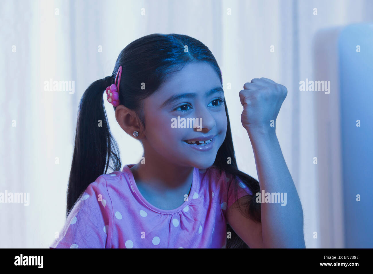 Young girl cheering Stock Photo - Alamy