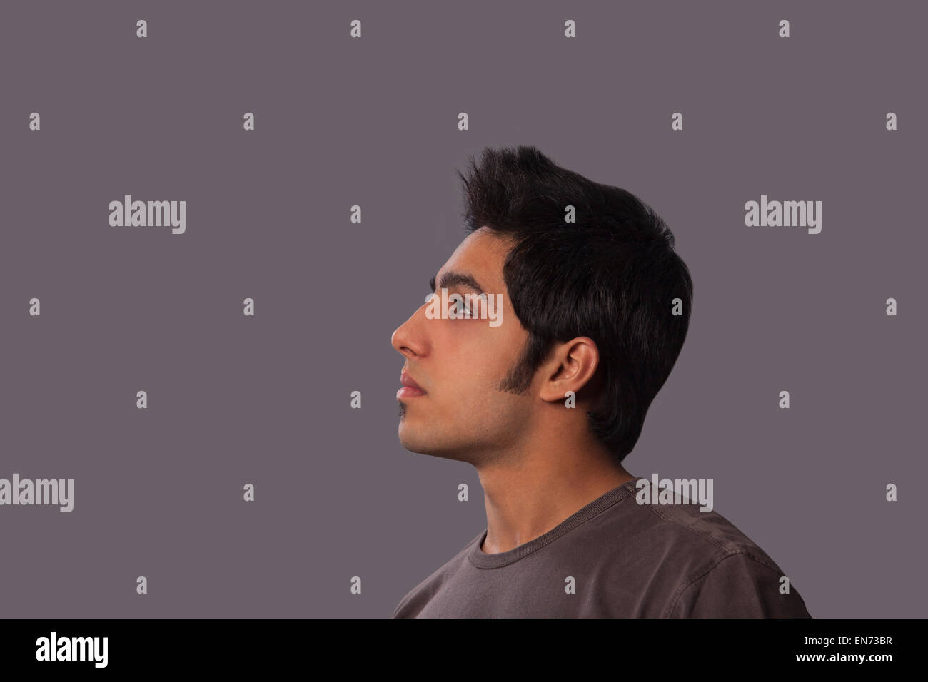 Young man looking up Stock Photo - Alamy