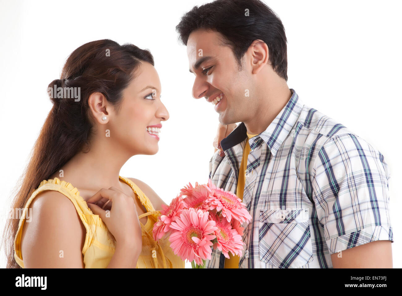 Young couple with flowers Stock Photo - Alamy