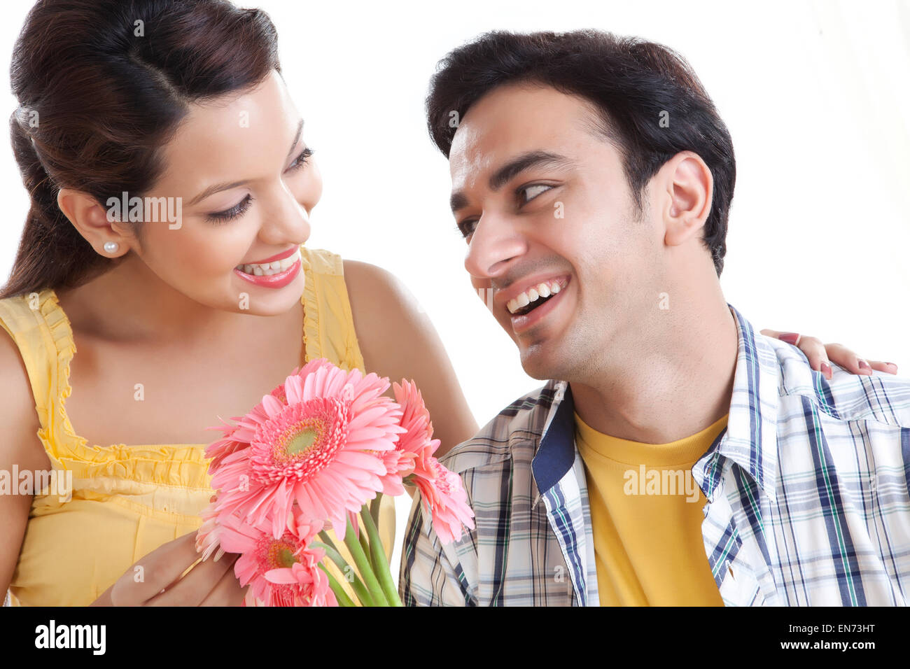 Young couple with flowers Stock Photo - Alamy
