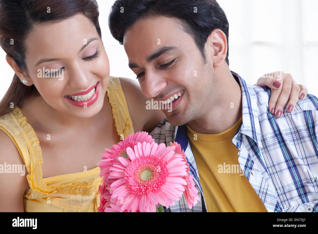 Young couple looking at flowers Stock Photo - Alamy