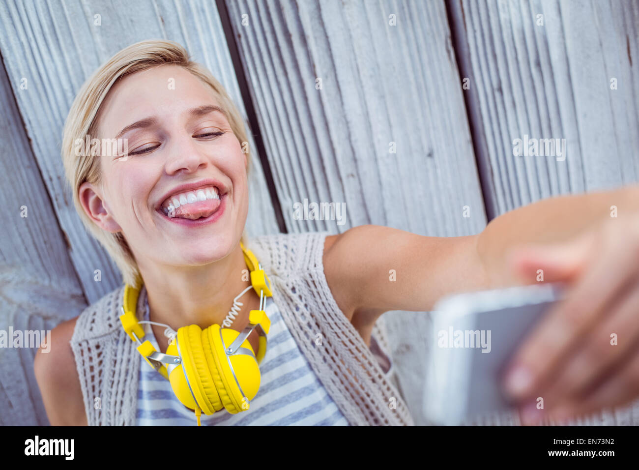 Pretty blonde woman taking selfie Stock Photo - Alamy