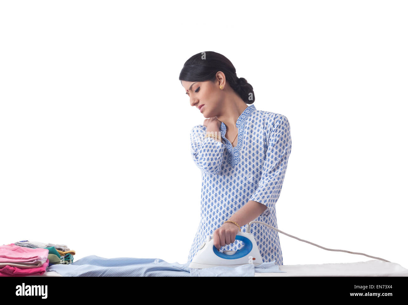Young woman ironing Stock Photo - Alamy