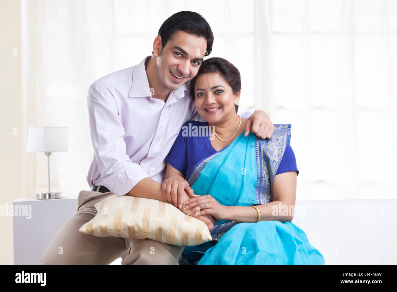 Mother and son sitting on couch hi-res stock photography and images - Alamy
