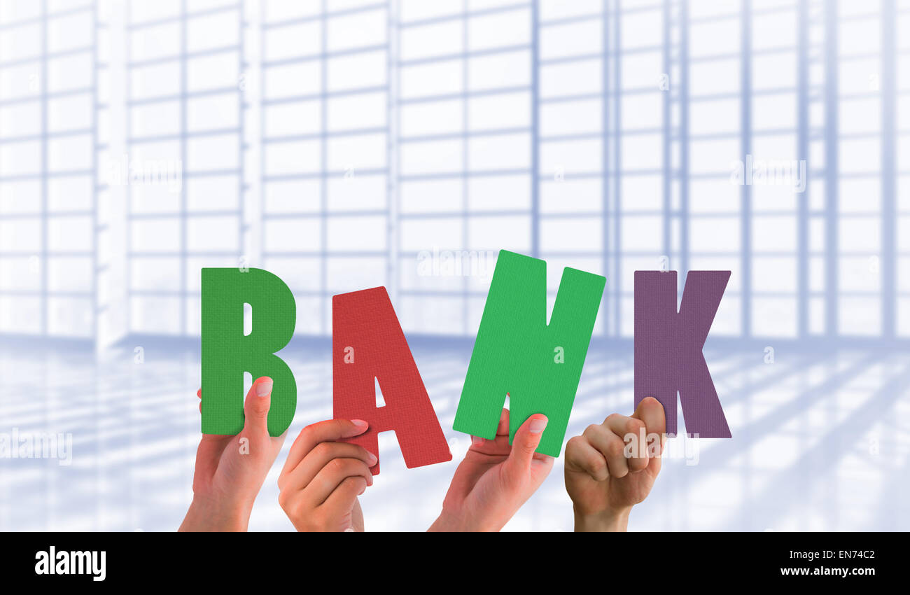 Composite image of hands holding up bank Stock Photo - Alamy